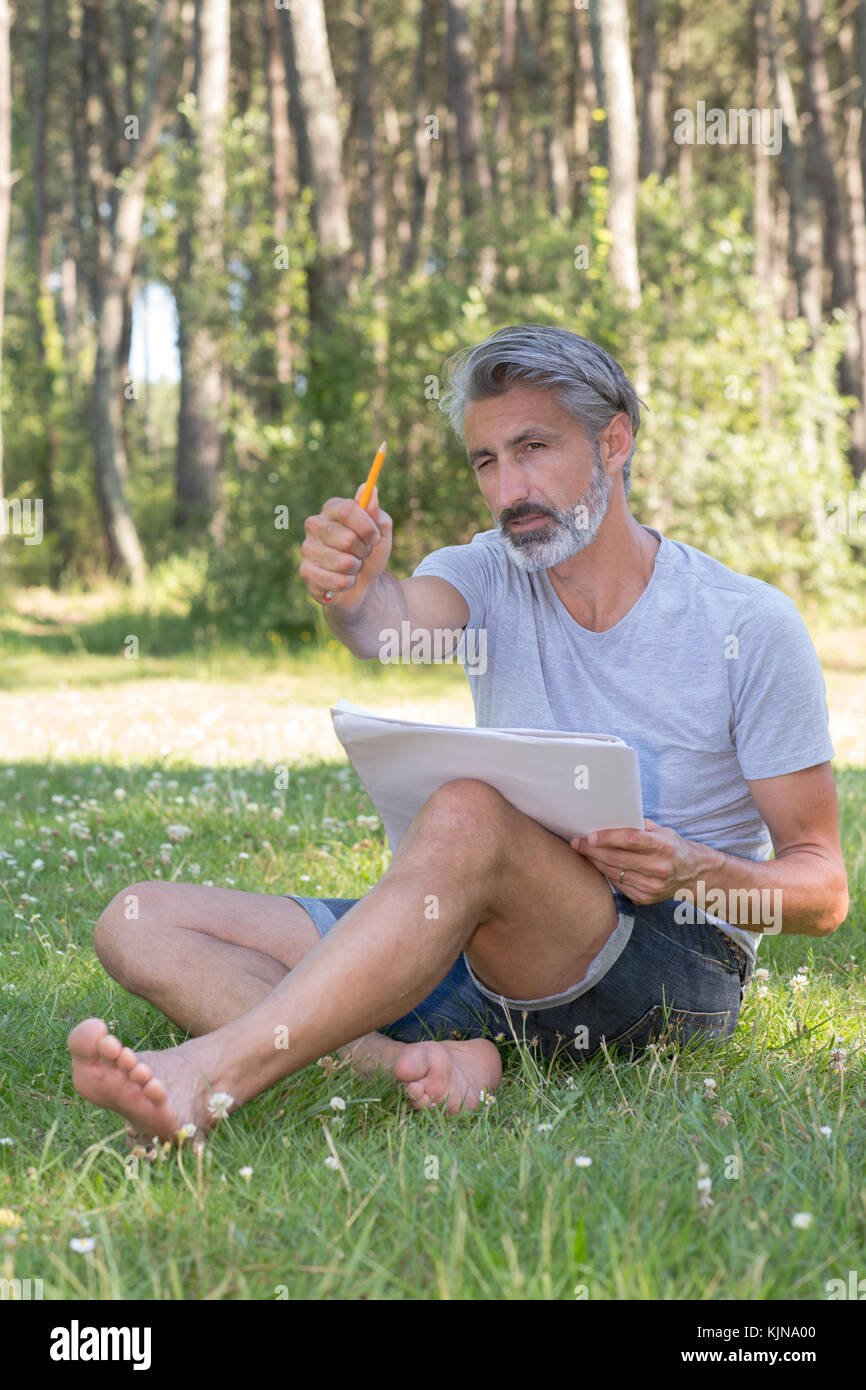 handsome man painting a spring landscape Stock Photo - Alamy