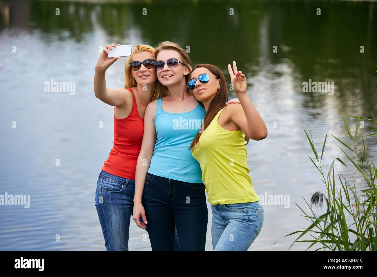 three girls having fun outdoors Stock Photo - Alamy