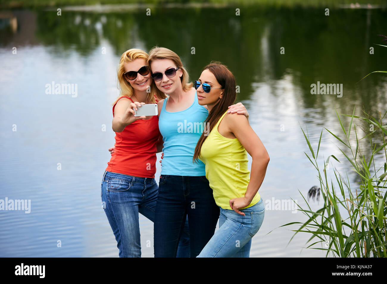 three girls having fun outdoors Stock Photo - Alamy