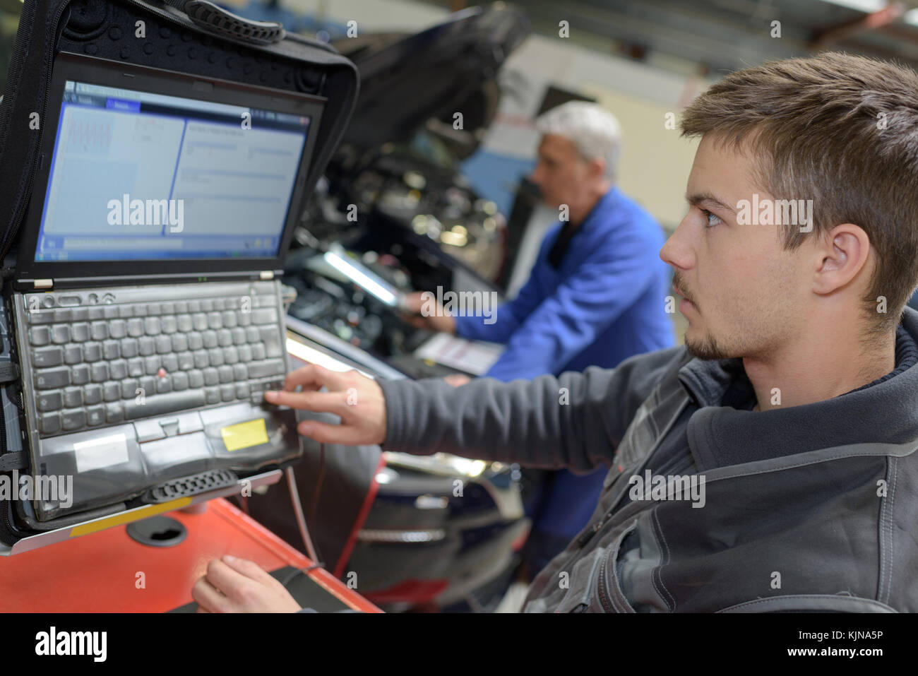 Female technician diagnosing male hi-res stock photography and images ...