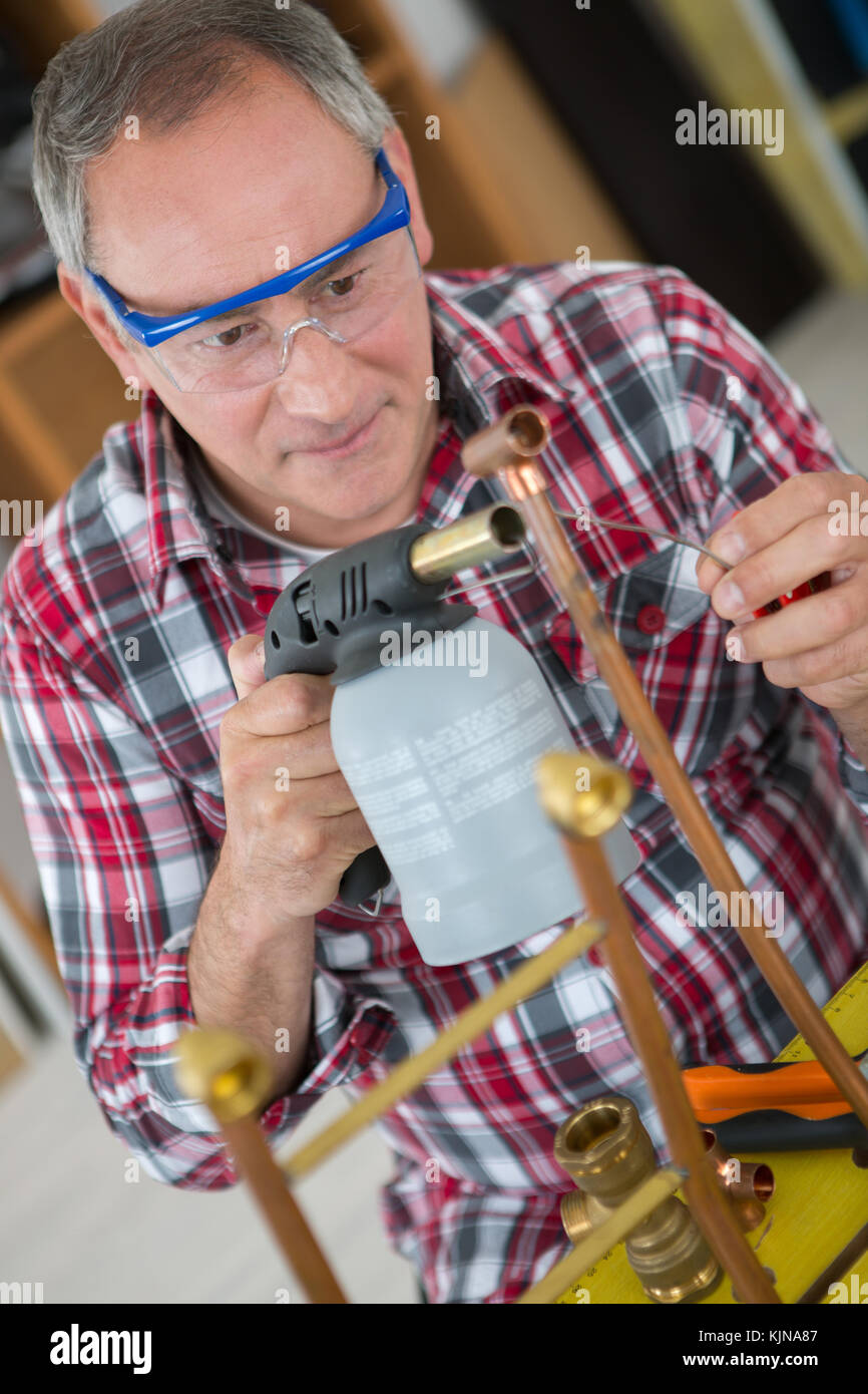 worker using a blowtorch Stock Photo - Alamy