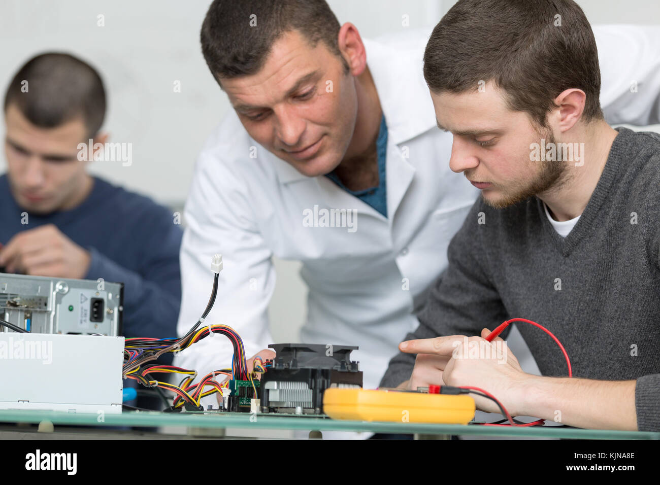 student in technology fixing computer processing Stock Photo - Alamy