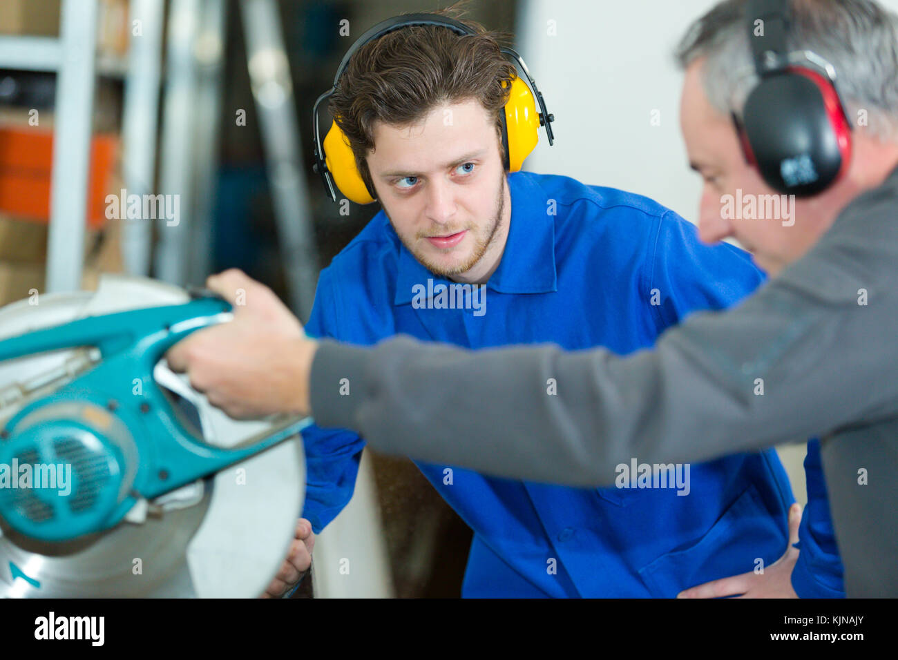 teacher with student in metallurgy workshop Stock Photo - Alamy