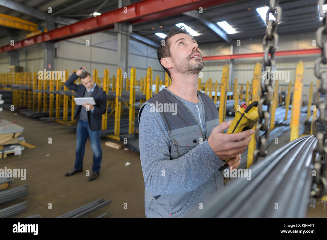 construction industrial worker operating warehouse elevator Stock Photo ...