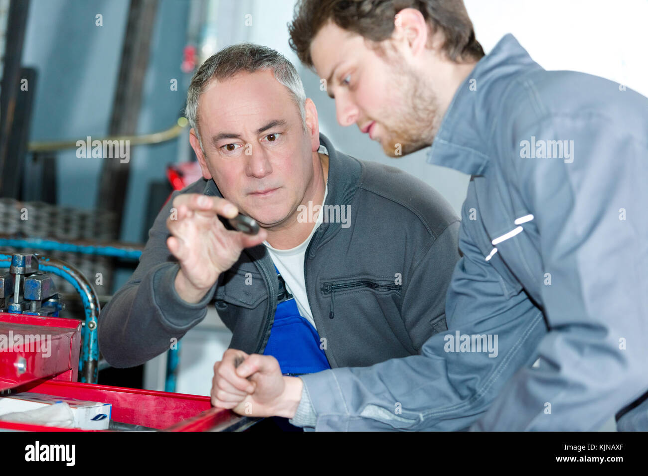 worker with apprentice Stock Photo - Alamy