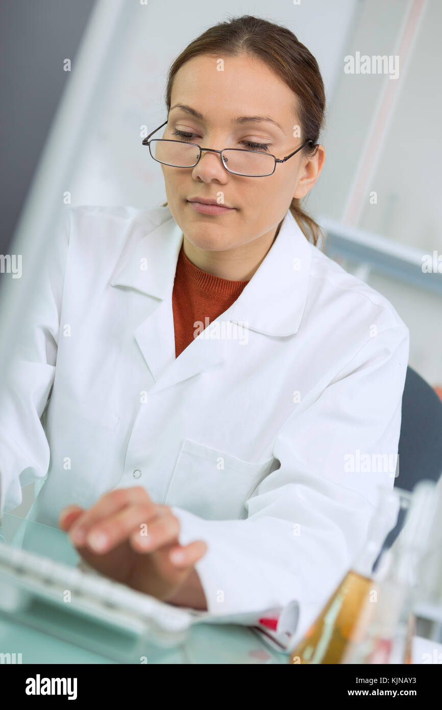 laboratory technician typing Stock Photo - Alamy