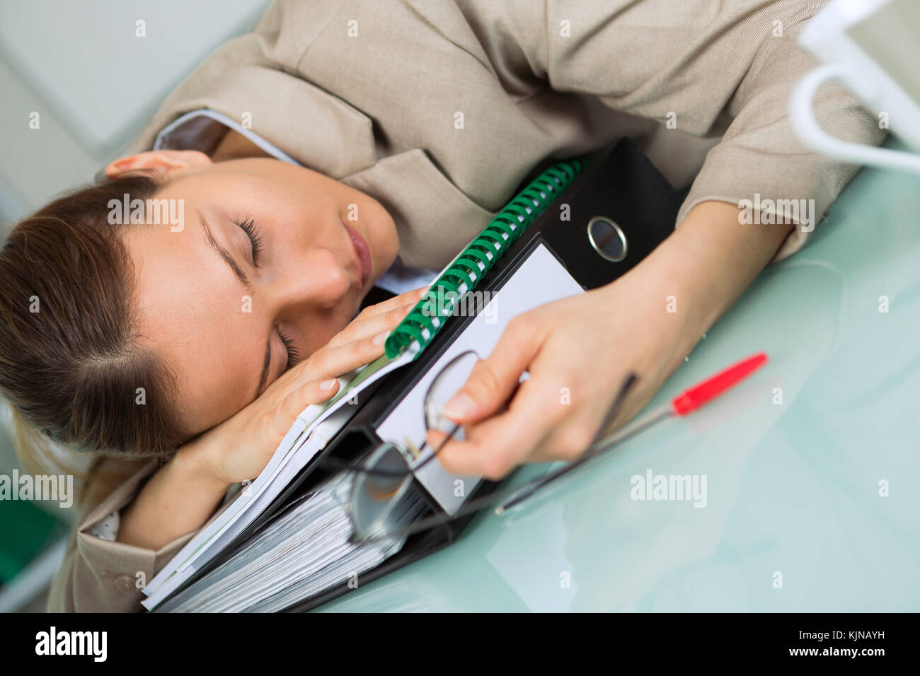 businesswoman sleeping in office Stock Photo - Alamy