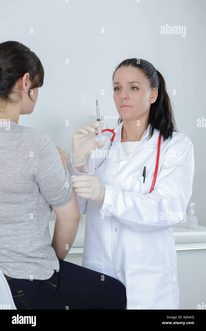 doctor injecting patients hand Stock Photo - Alamy