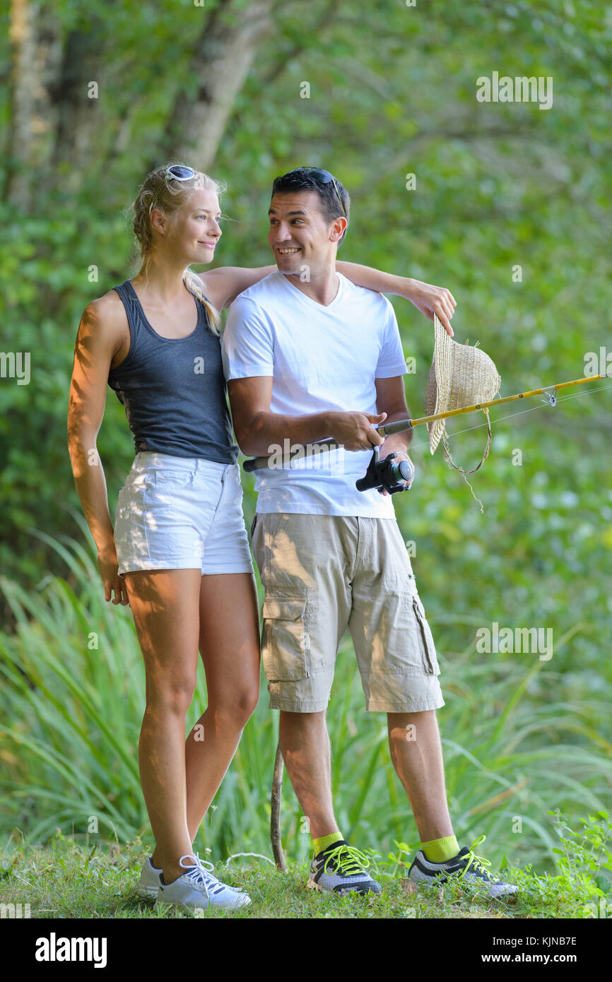 couple fishing in nature Stock Photo - Alamy