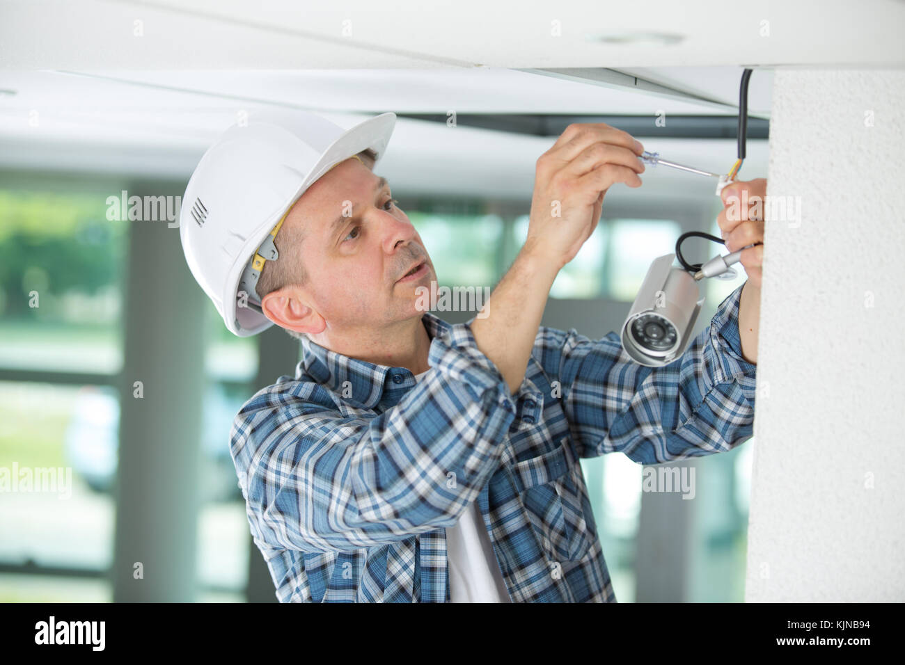professional cctv technician working Stock Photo - Alamy