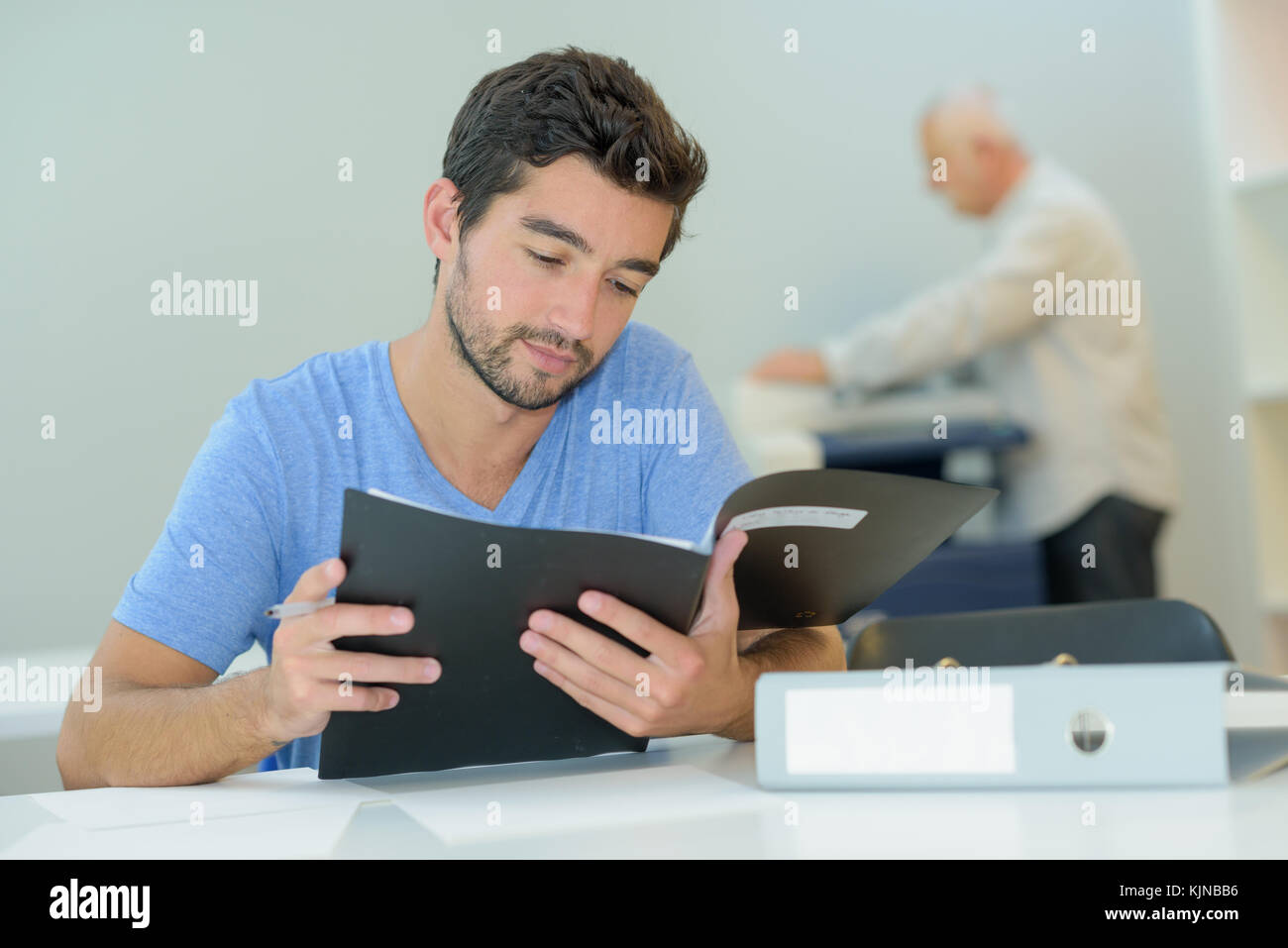 university student working in a classroom Stock Photo - Alamy