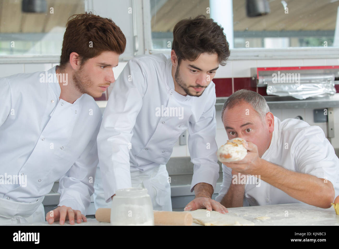 professional cook with apprentice Stock Photo - Alamy