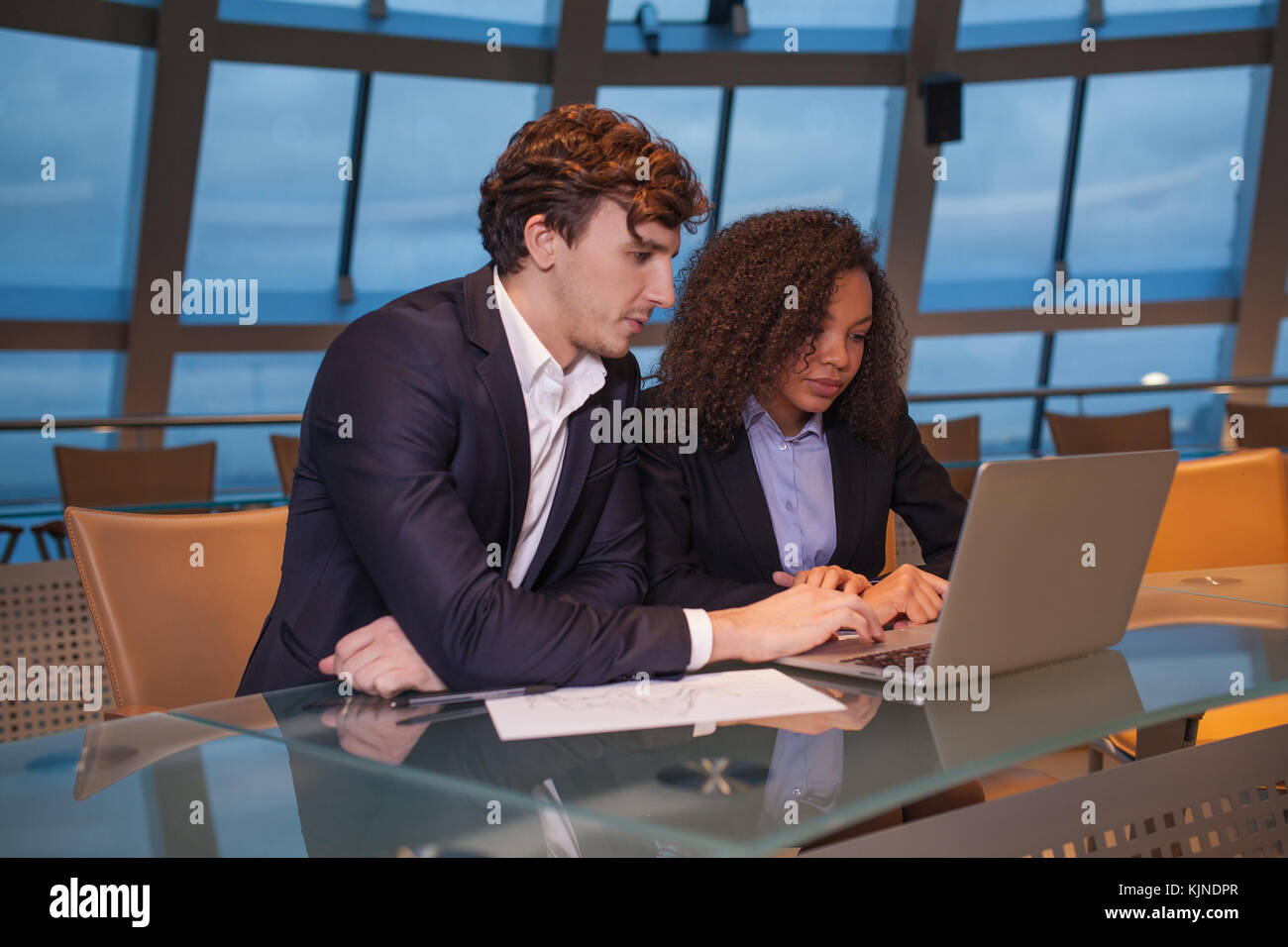 Businessman sitting around boardroom table hi-res stock photography and ...