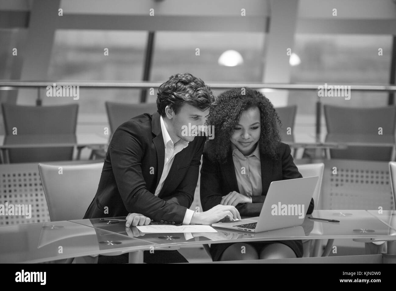 Business people having meeting around table in modern office Stock ...