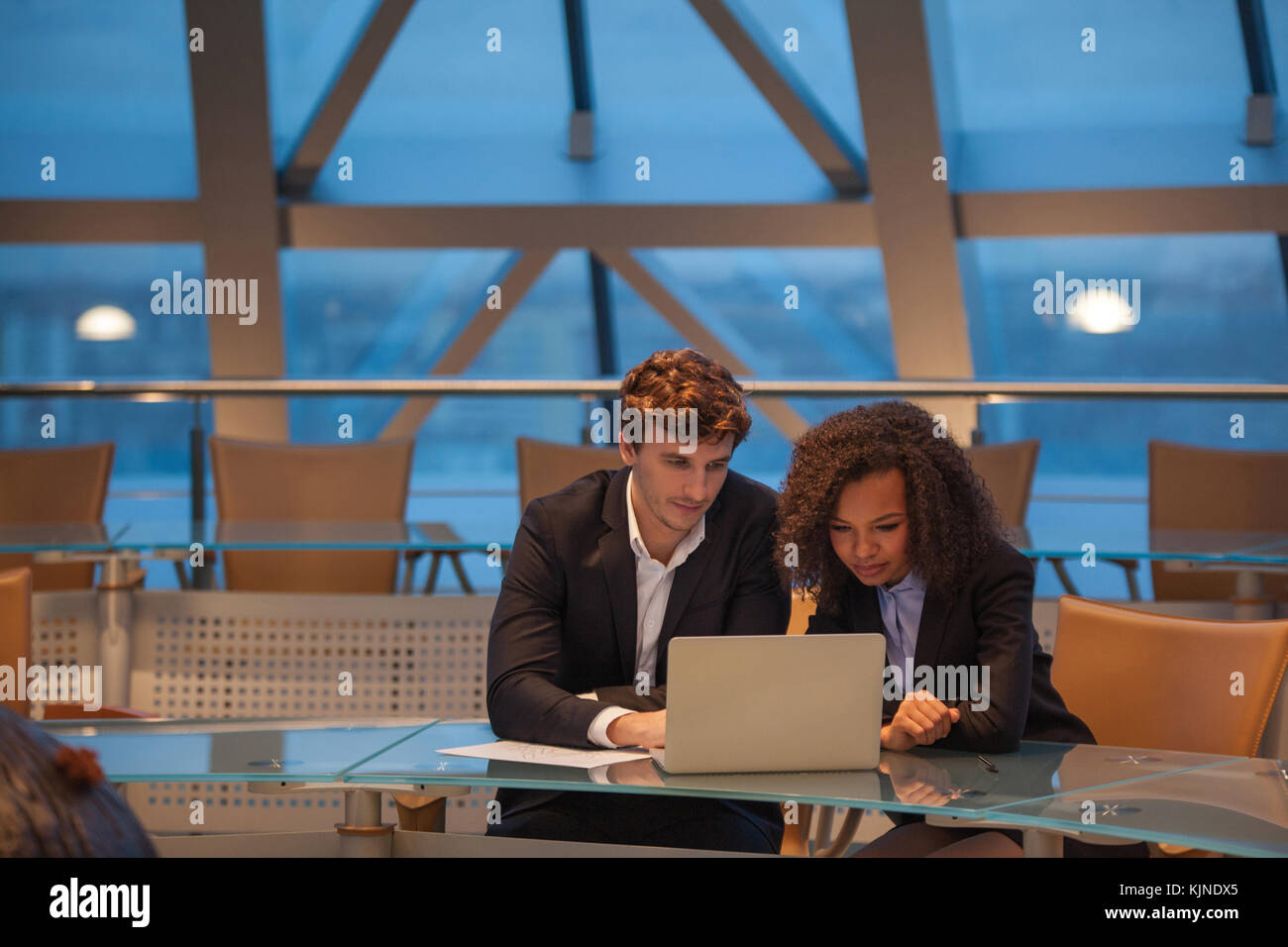 Business people having meeting around table in modern office Stock ...