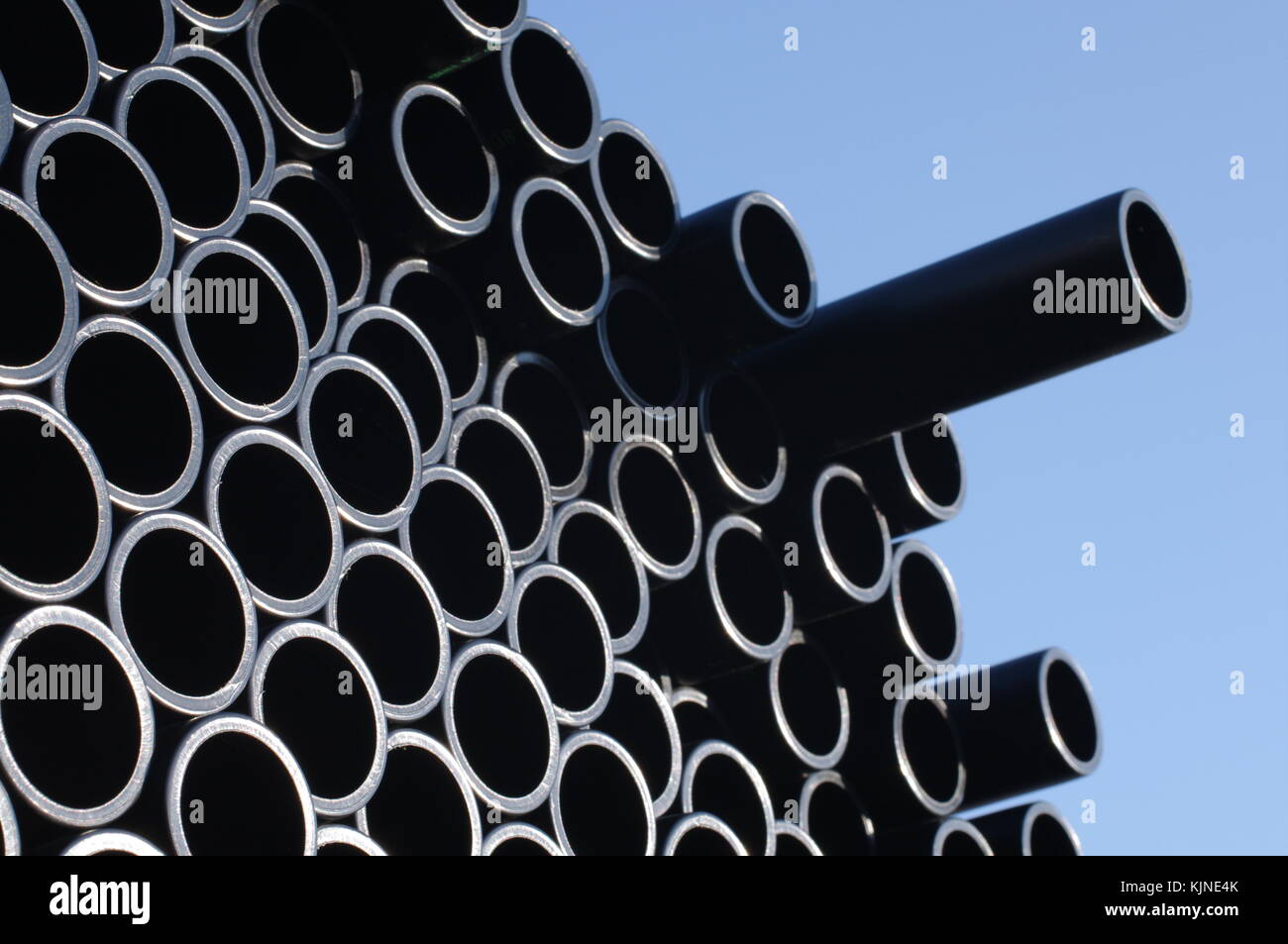 Pile out of pipes Stock Photo - Alamy