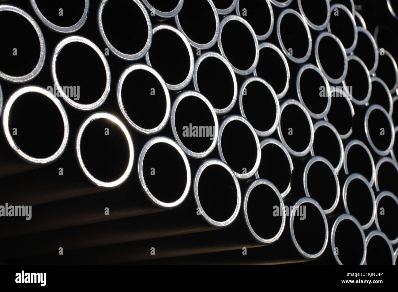 Pile out of pipes Stock Photo - Alamy