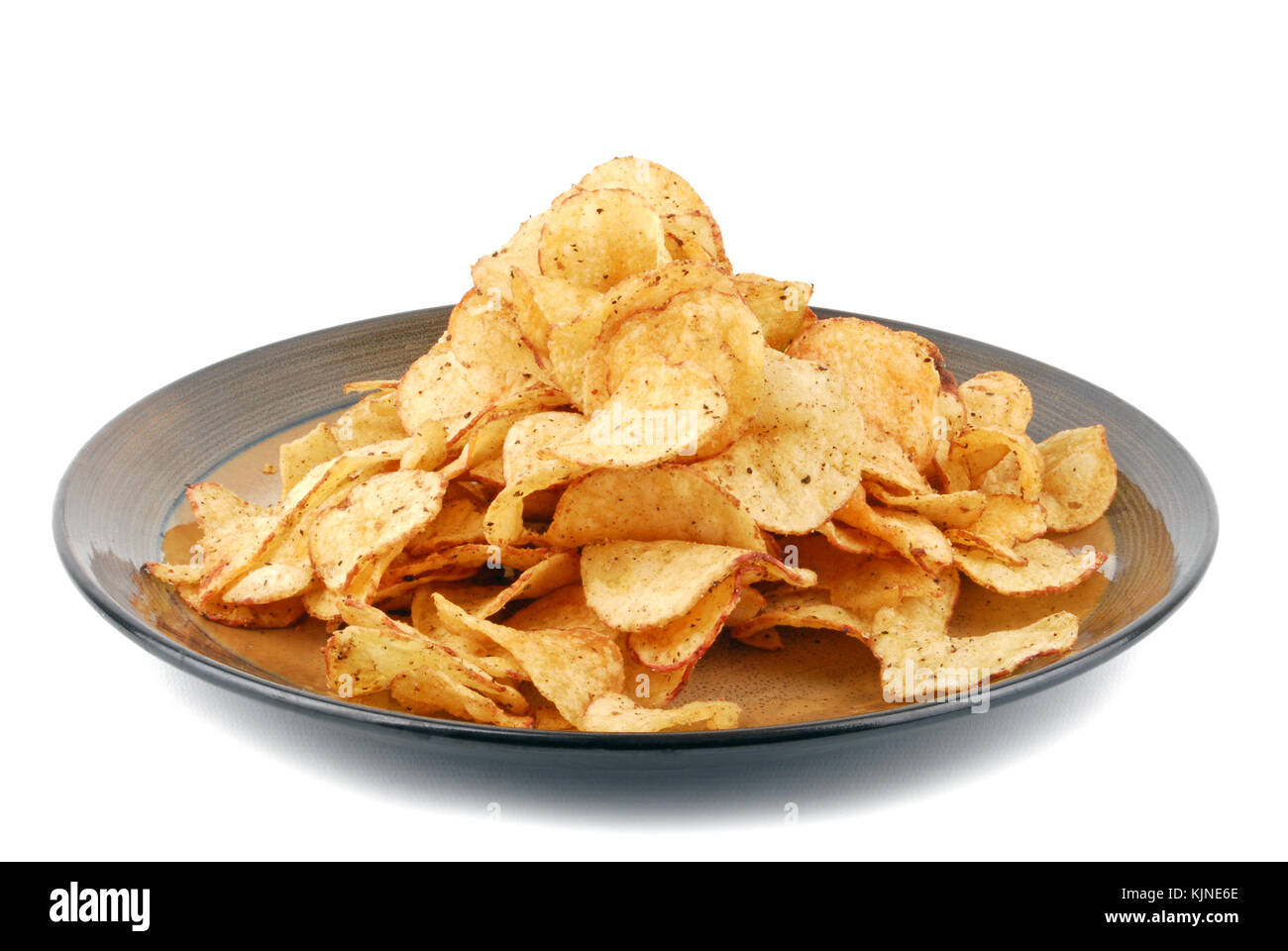 Vegetable chips on plate Cut Out Stock Images & Pictures - Alamy