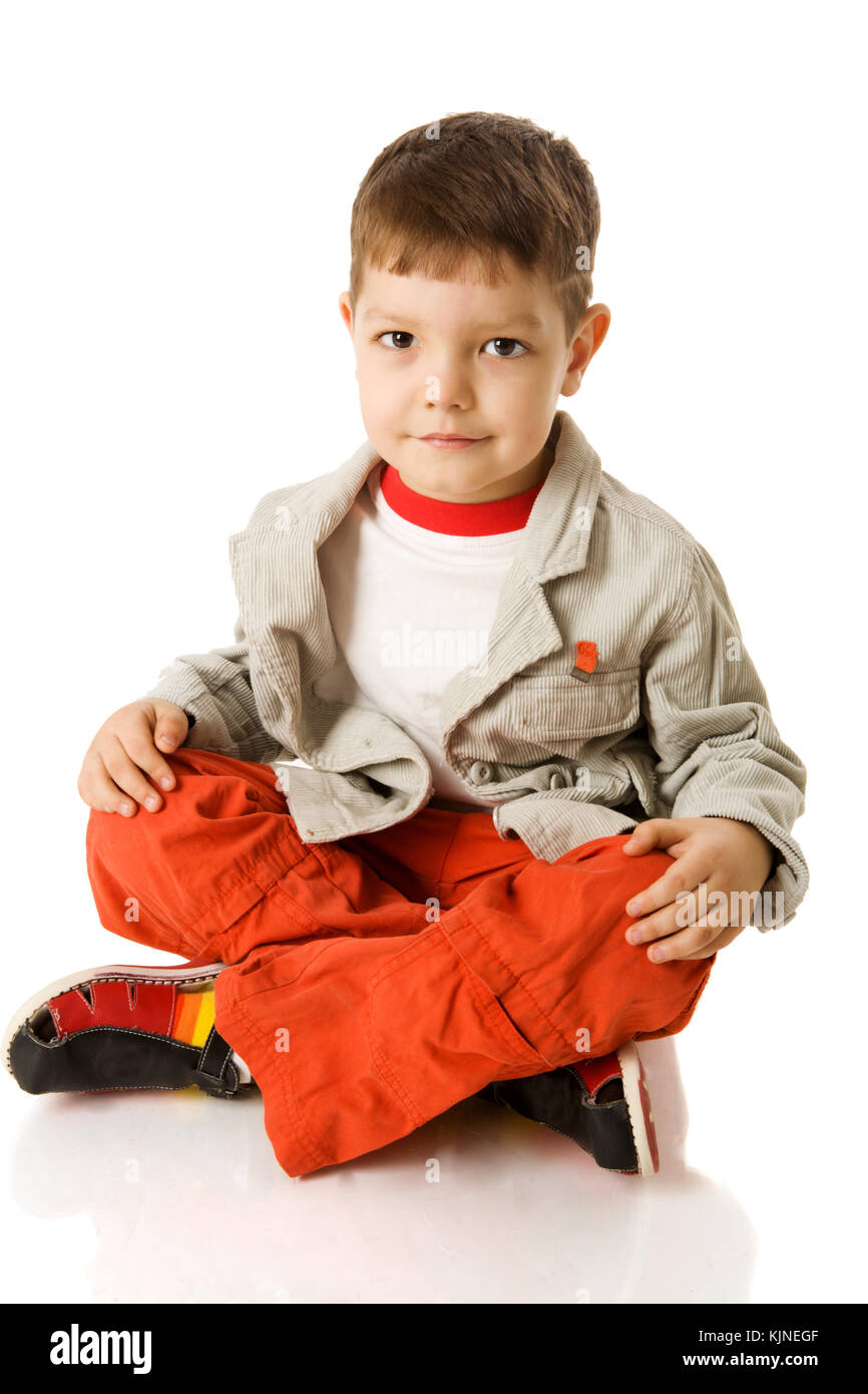 Four years boy sitting on floor isolated on white Stock Photo - Alamy