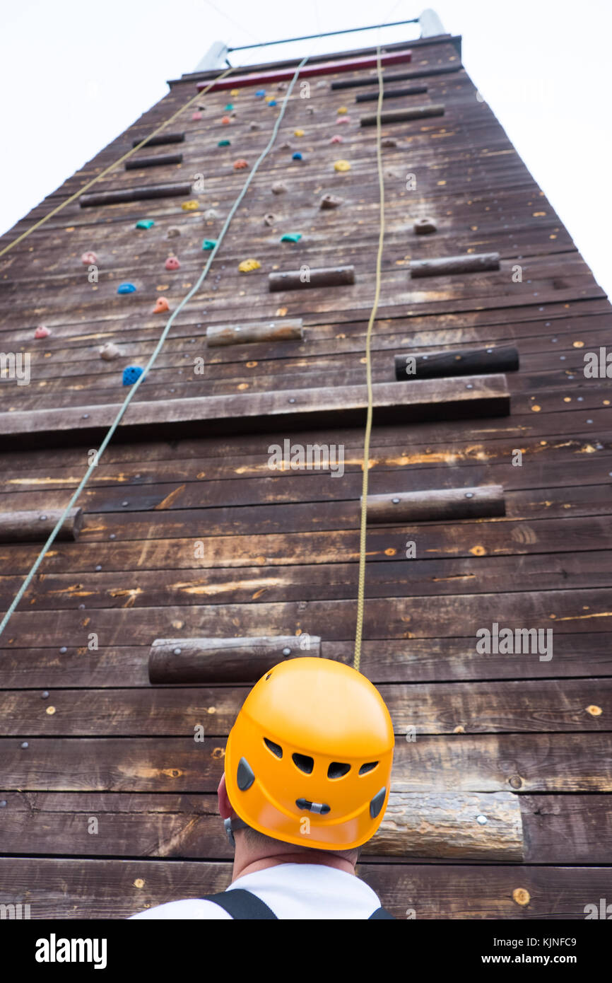 climbing wood wall at safety adventure park Stock Photo - Alamy