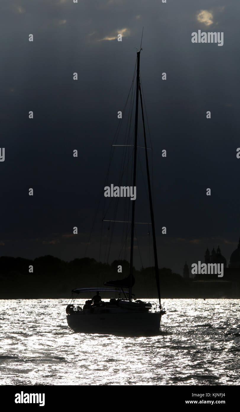 boat on the sea with backlit photographic effect Stock Photo - Alamy