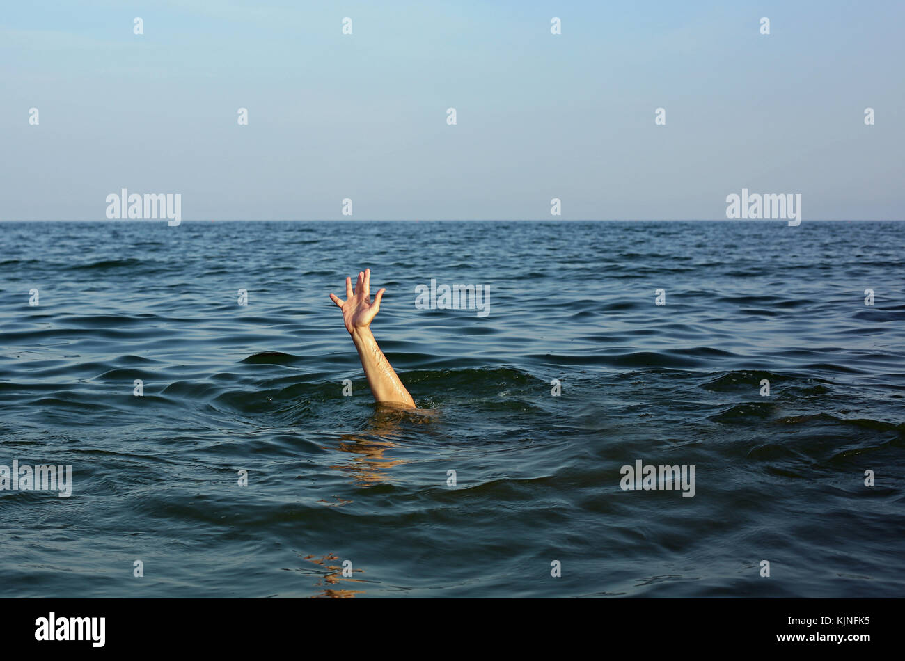 hand of the man while asking for help drowning in the sea Stock Photo ...