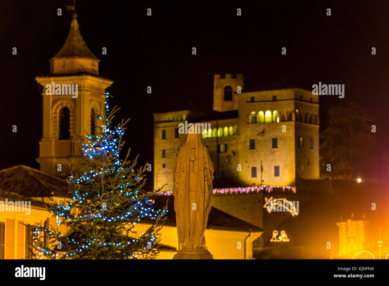 night view of back of statue of the Blessed Virgin Mary in front of ...