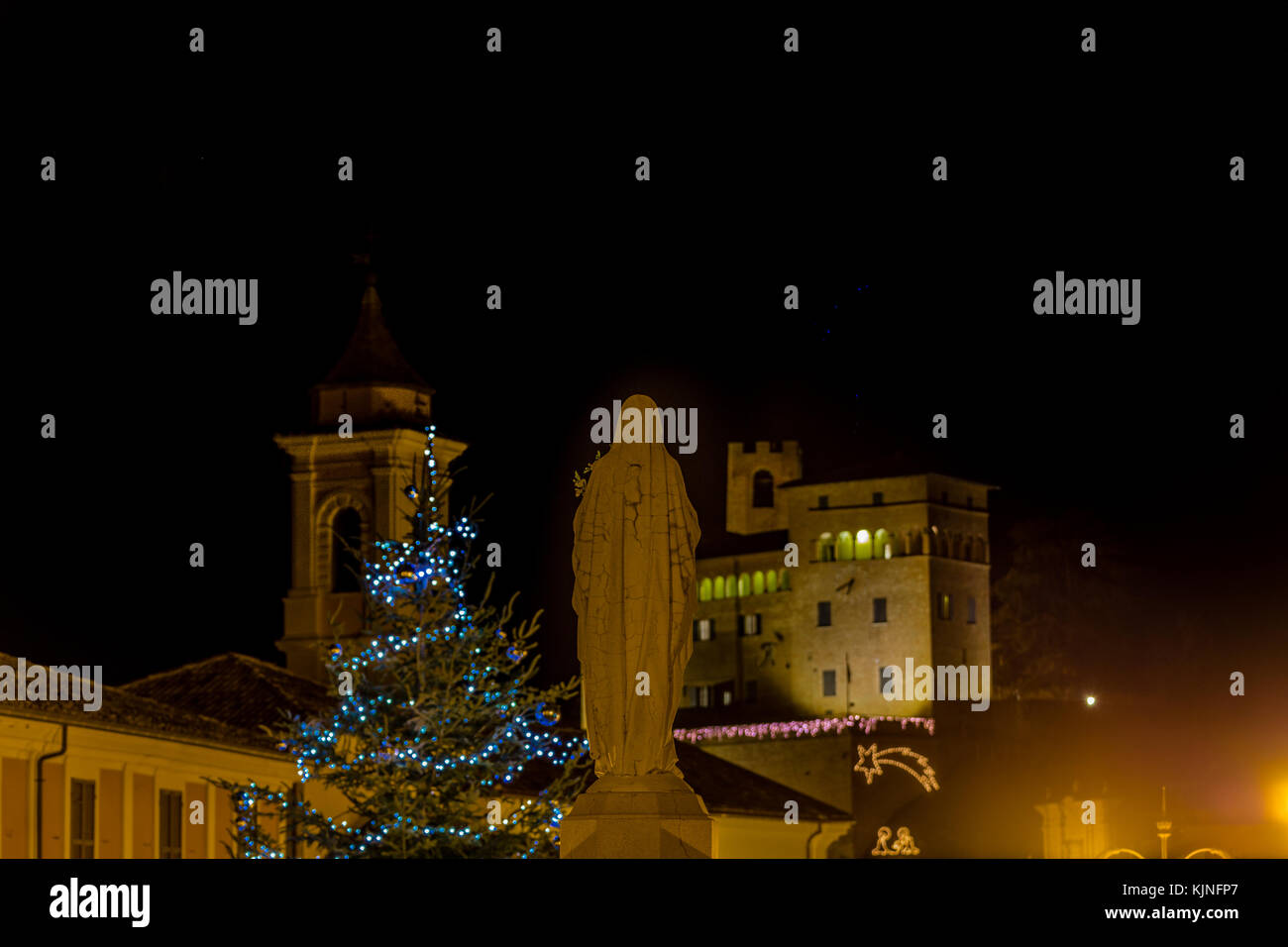 night view of back of statue of the Blessed Virgin Mary in front of ...