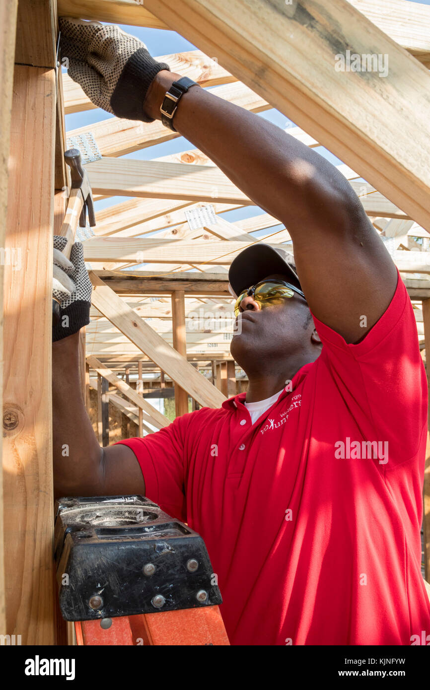 Houston, Texas - Volunteers from Wells Fargo Bank help build a Habitat ...