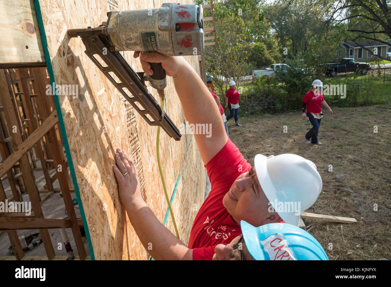 Houston, Texas - Volunteers from Wells Fargo Bank help build a Habitat ...