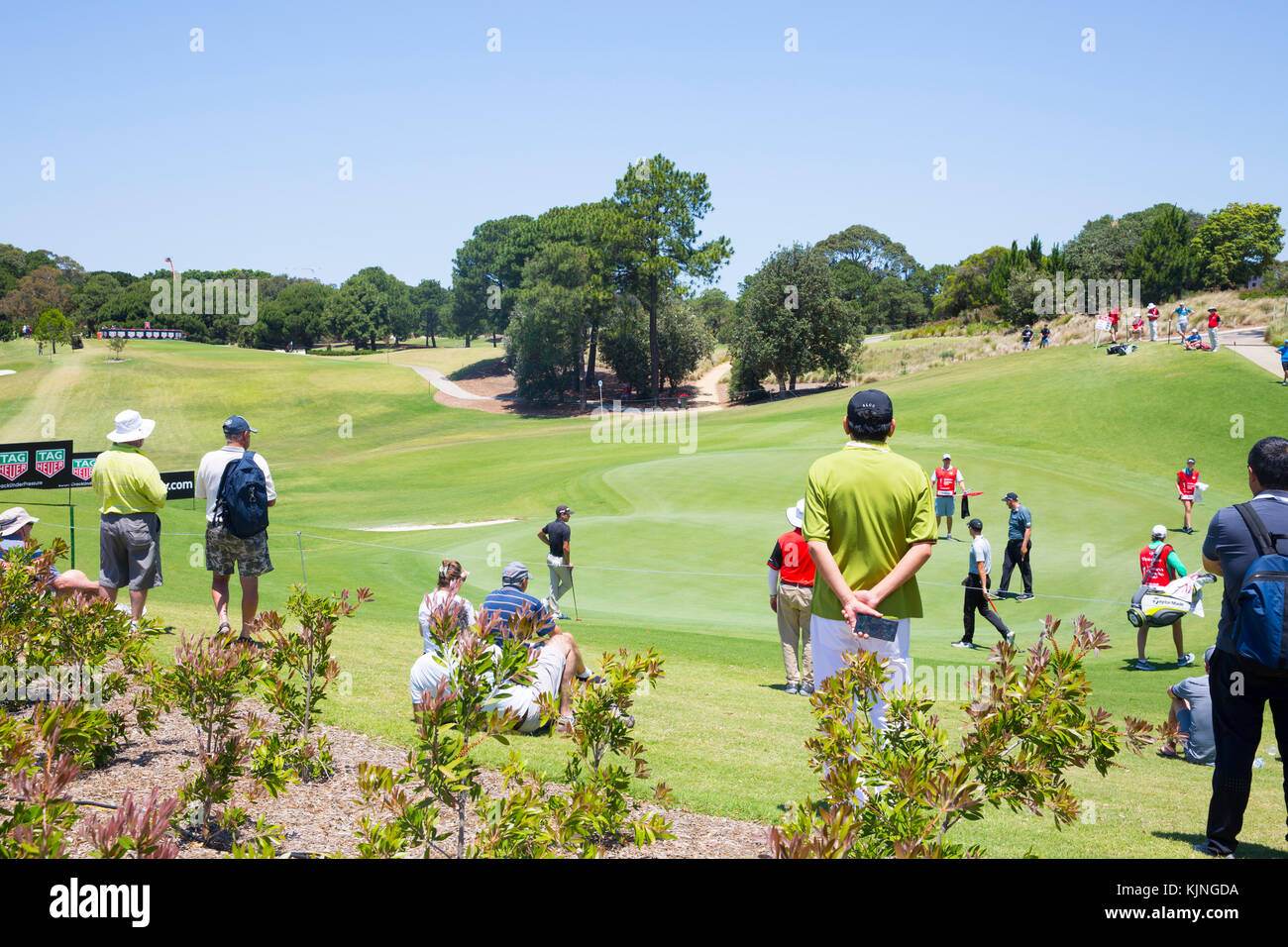 Professional golfers putting on the green at the Emirates Australian ...