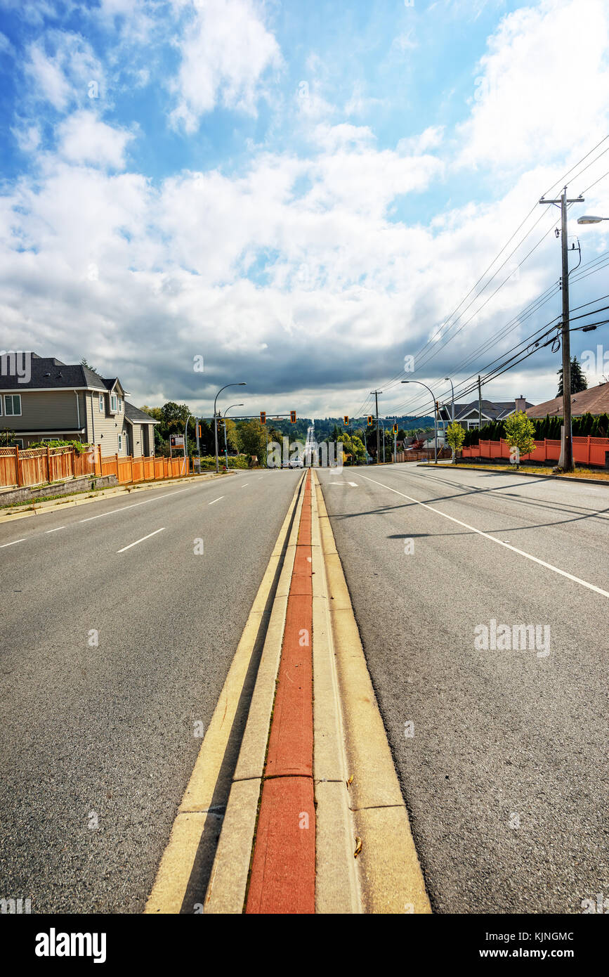 beautiful asphalt road in the suburbs with beautiful scenery, blue sky ...