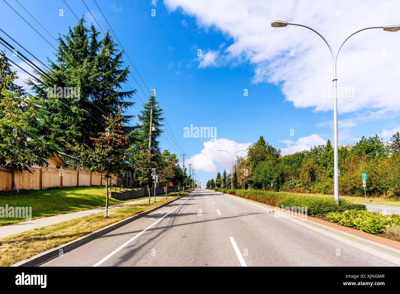 beautiful asphalt road in the suburbs with beautiful scenery, blue sky ...