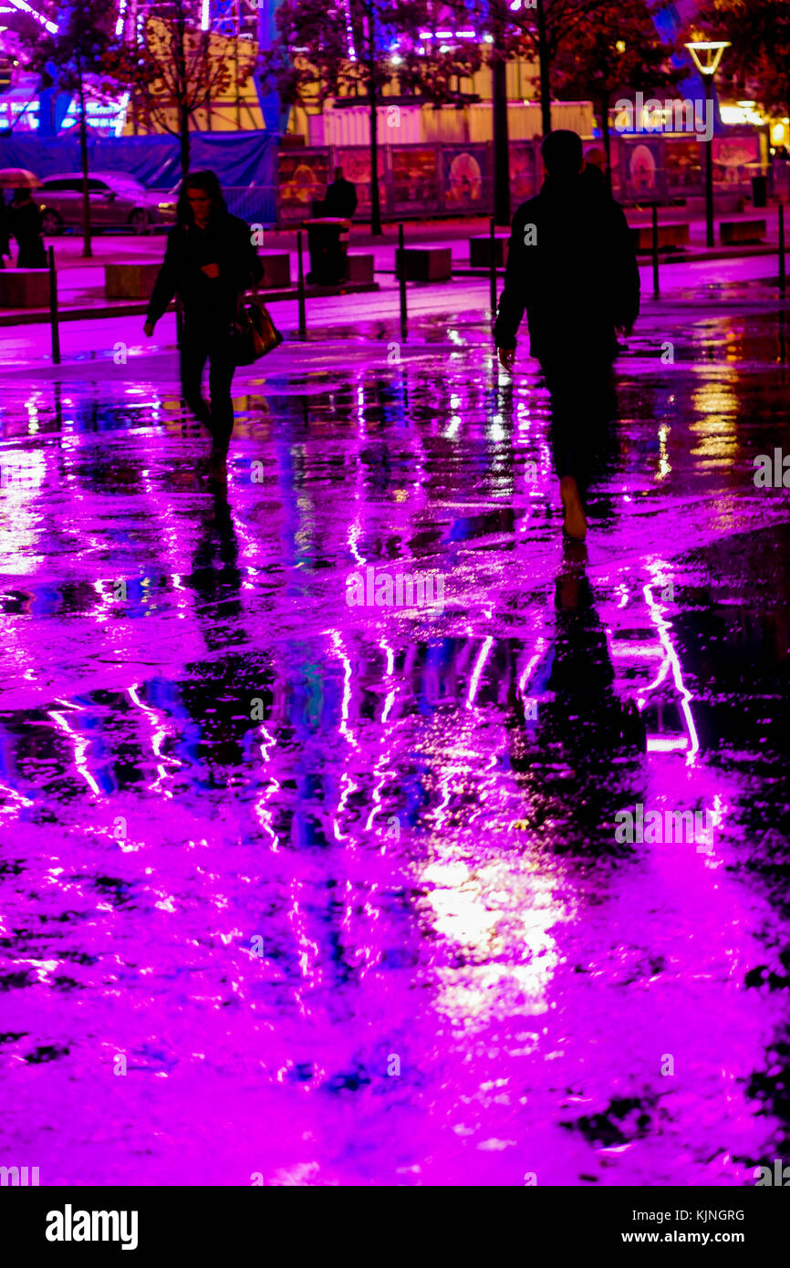 Traditional Ferris Wheel reflects on wet pavement, Lyon, France Stock ...