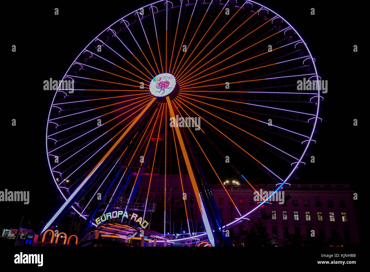 Traditional Ferris Wheel glows in Christmas lights, Lyon, France Stock ...