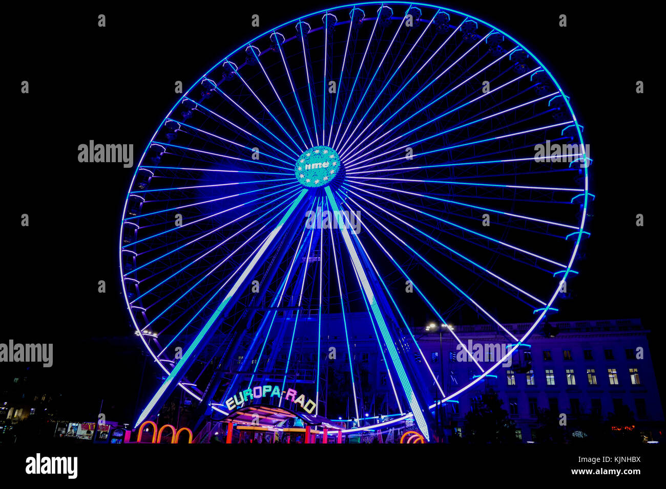 Traditional Ferris Wheel glows in Christmas lights, Lyon, France Stock ...