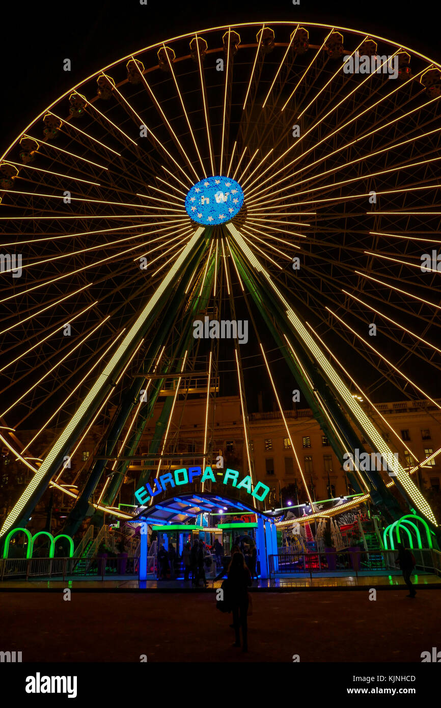 Traditional Ferris Wheel glows in Christmas lights, Lyon, France Stock ...