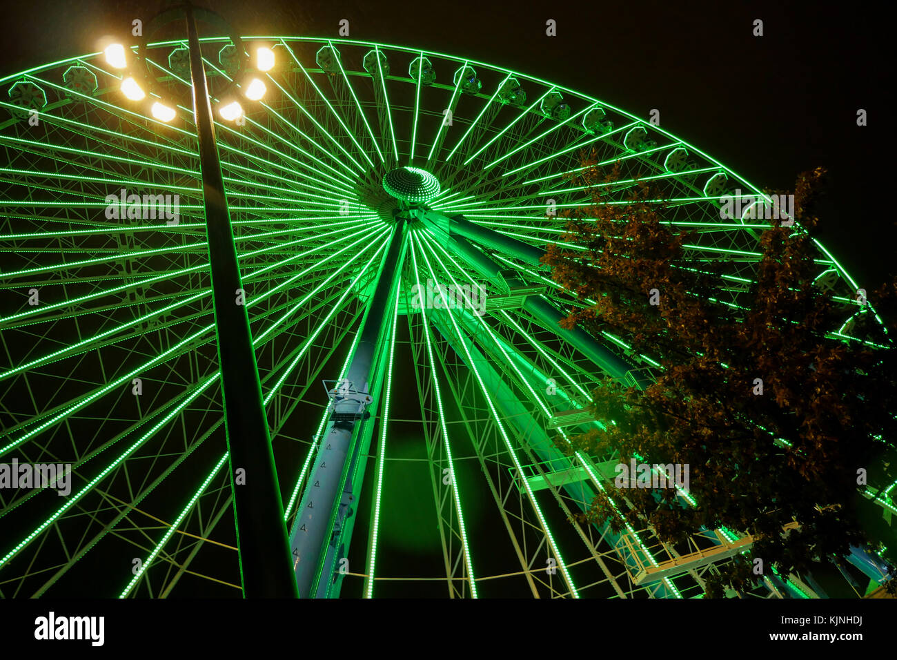 Traditional Ferris Wheel glows in Christmas lights, Lyon, France Stock ...