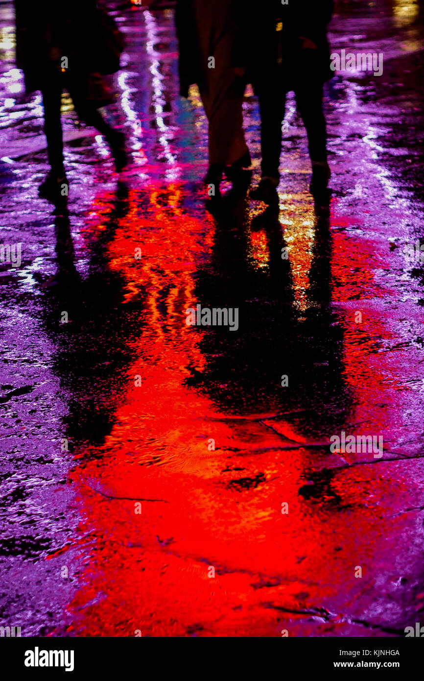 Traditional Ferris Wheel reflects on wet pavement, Lyon, France Stock ...