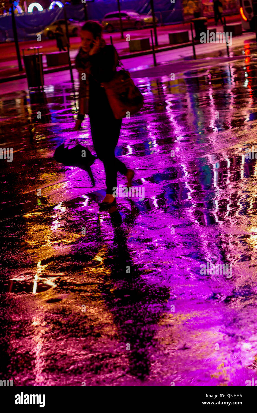 Traditional Ferris Wheel reflects on wet pavement, Lyon, France Stock ...