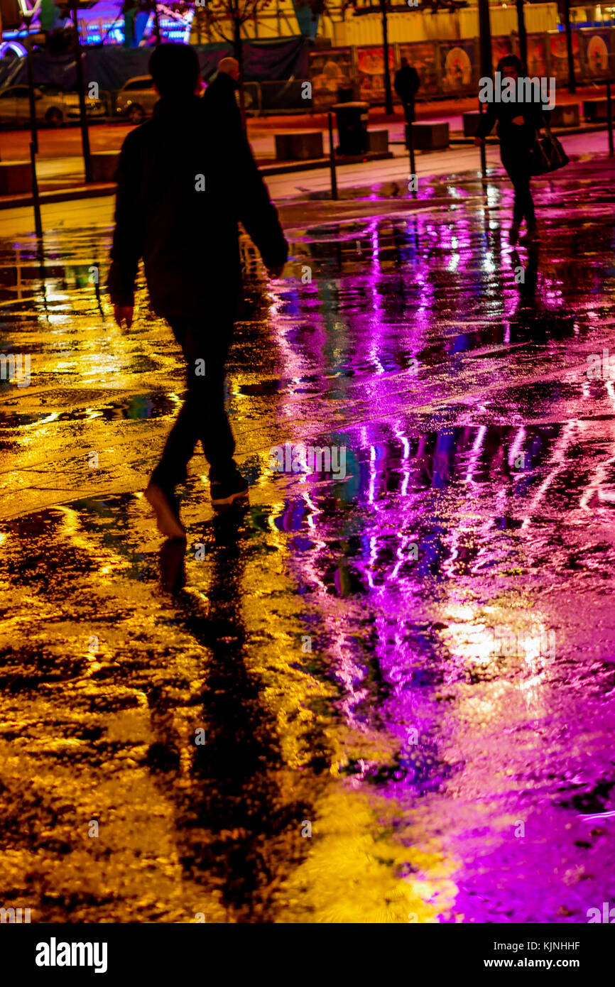 Traditional Ferris Wheel reflects on wet pavement, Lyon, France Stock ...