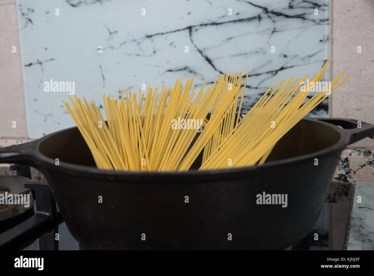 Pasta inside a pot ready to be cooked Stock Photo - Alamy
