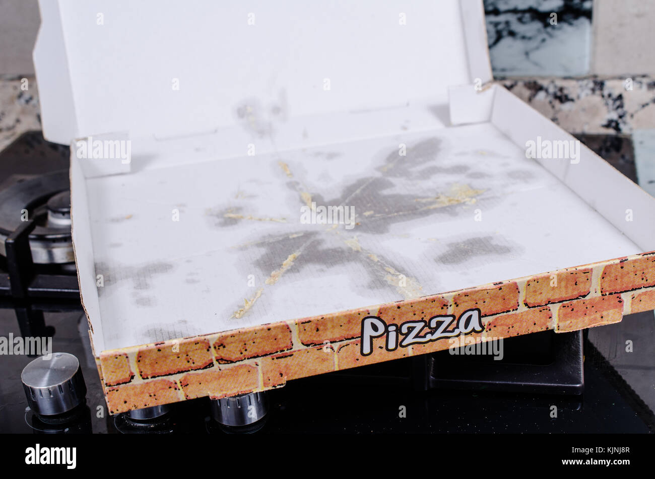 Empty pizza box with grease stains, a fast food concept Stock Photo - Alamy