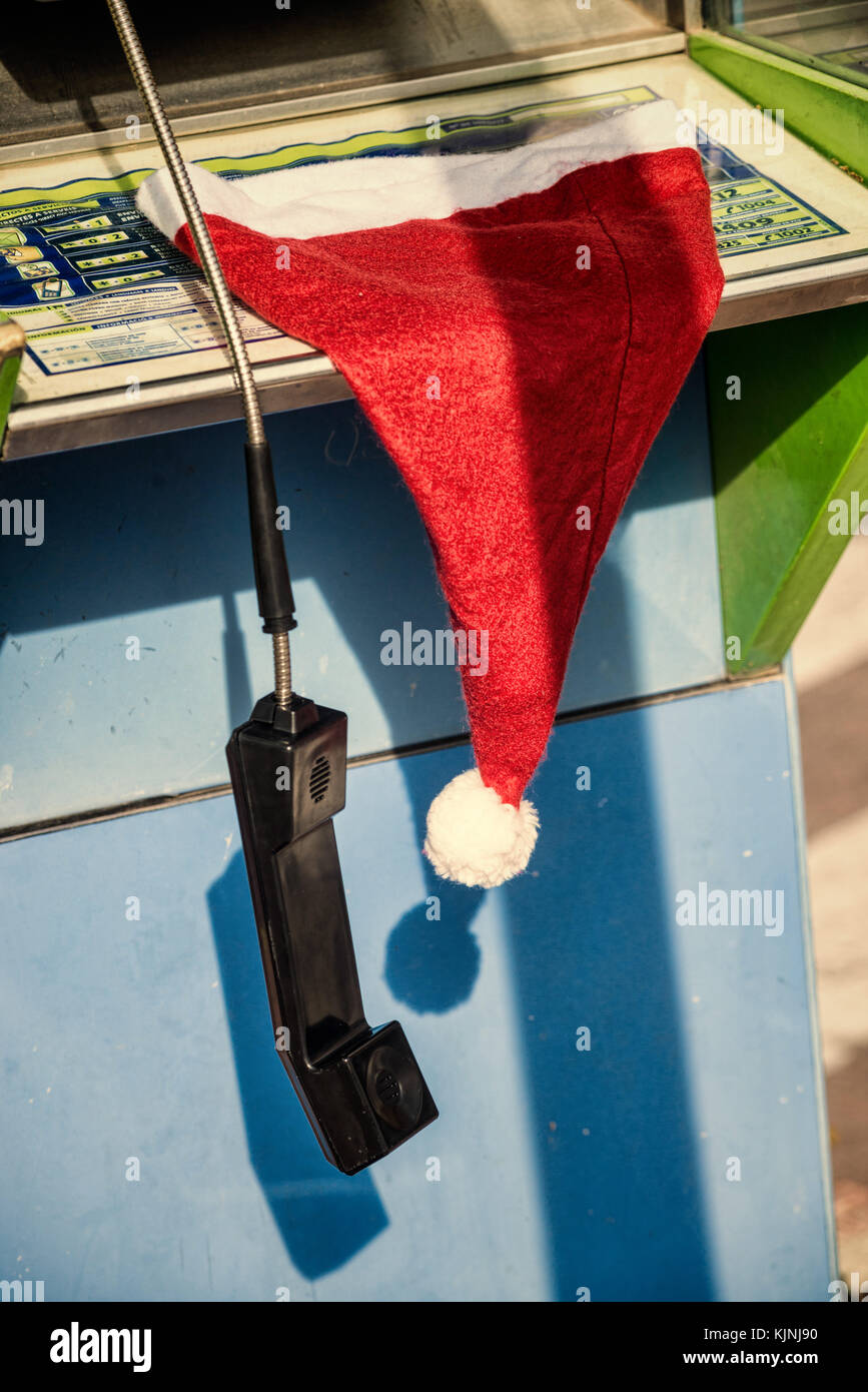Phone booth with a Santa hat, calling Santa, a Christmas season concept ...