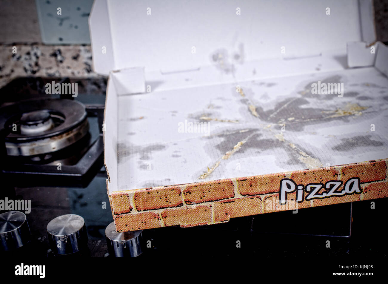 Empty pizza box with grease stains, a fast food concept Stock Photo - Alamy