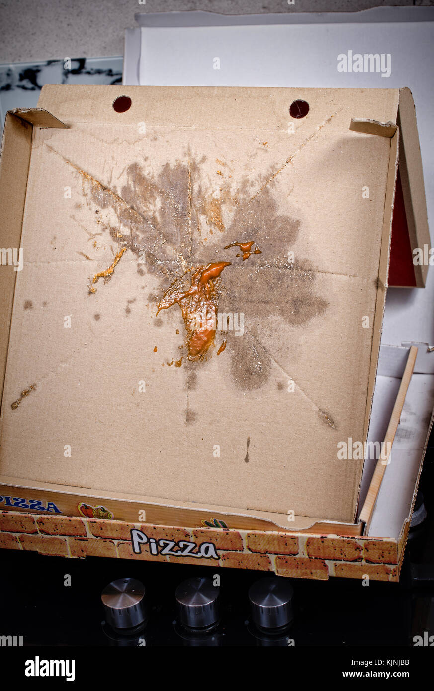 Empty pizza box with grease stains, a fast food concept Stock Photo - Alamy