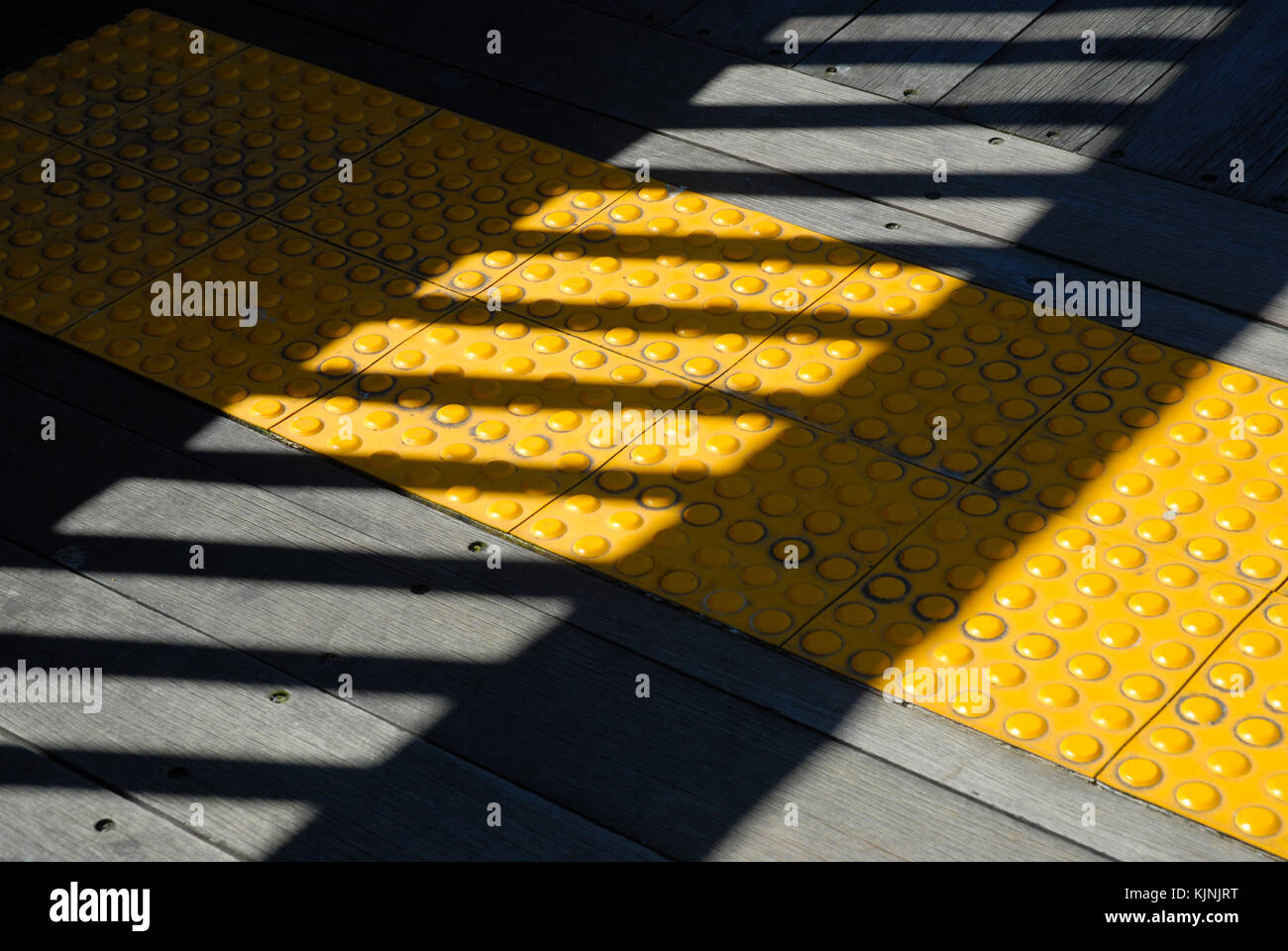 Yellow dimpled path that acts as a guide for the blind, Perth ...