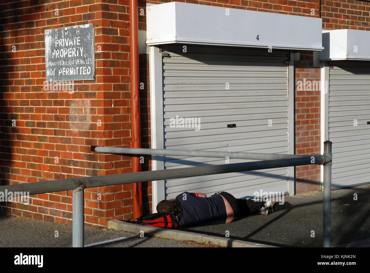 Tramp outside garage, Perth, Western Australia Stock Photo - Alamy