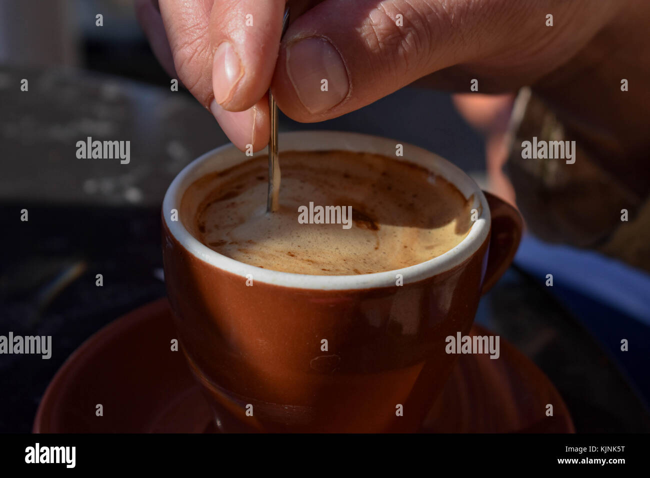 Close Up Of Man's Hand Mixing Coffee With Spoon Stock Photo - Alamy