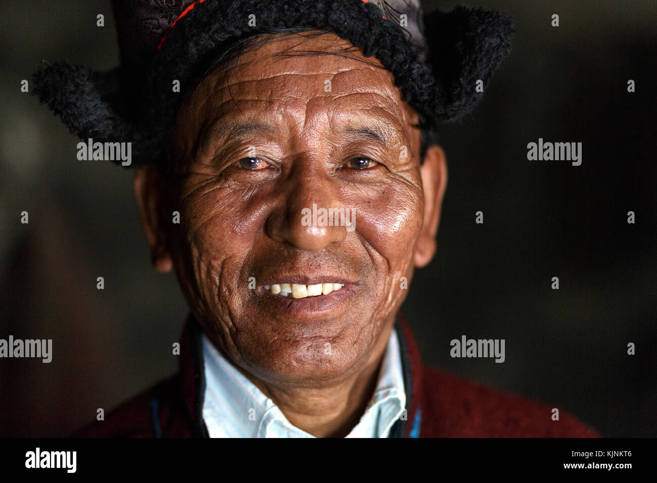 Ladakhi man in traditional clothes inside his house, Leh, Ladakh, Jammu ...